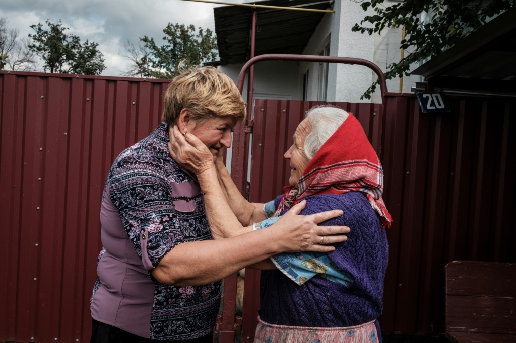 Tears of relief as Ukraine frontline families reunite