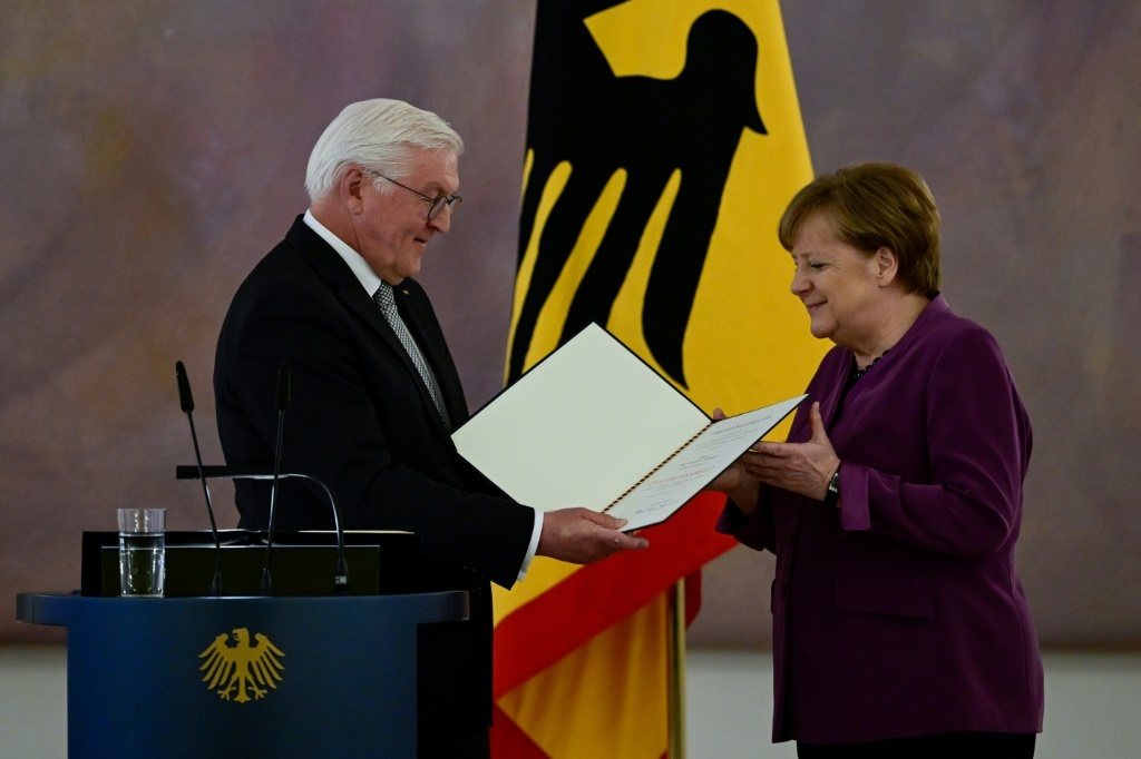 Merkel given Germany's top honour despite criticism